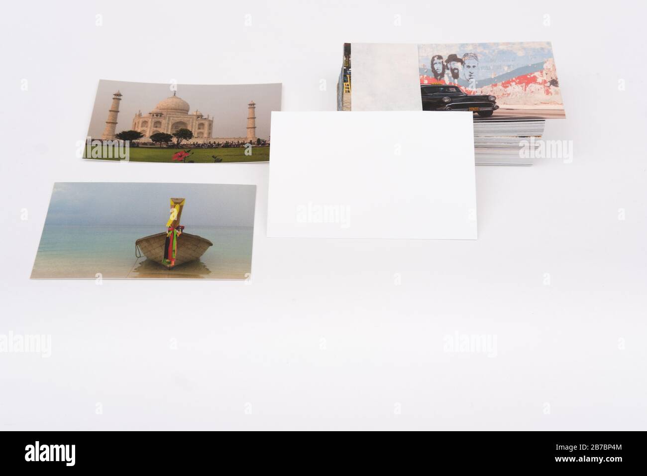 Stack of travel photography theme business cards with one blank card ...