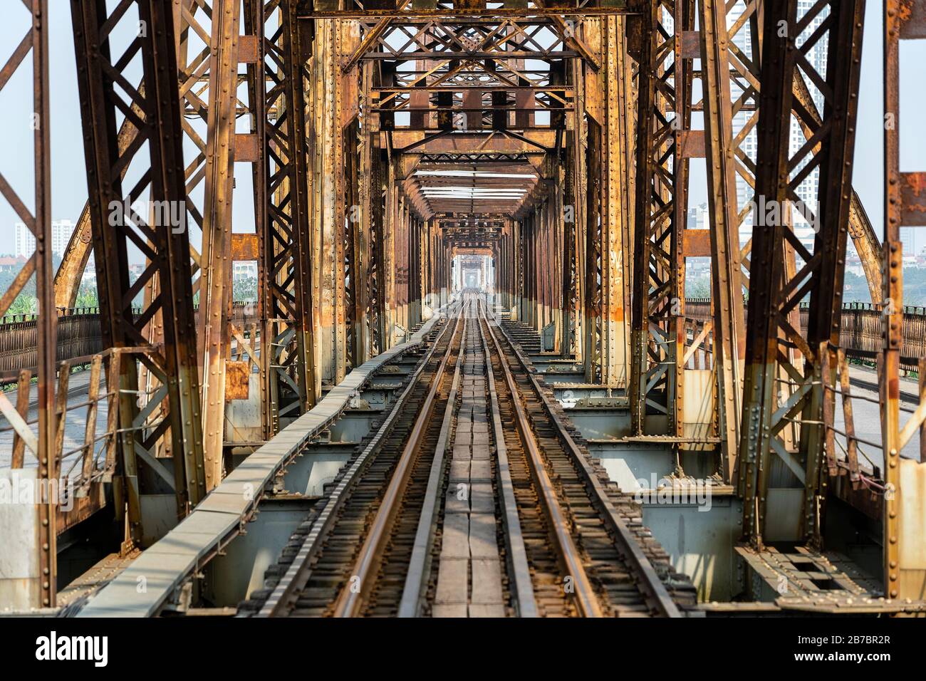 Ancient train steel bridge Long Bien railway with pedestrian through a ...