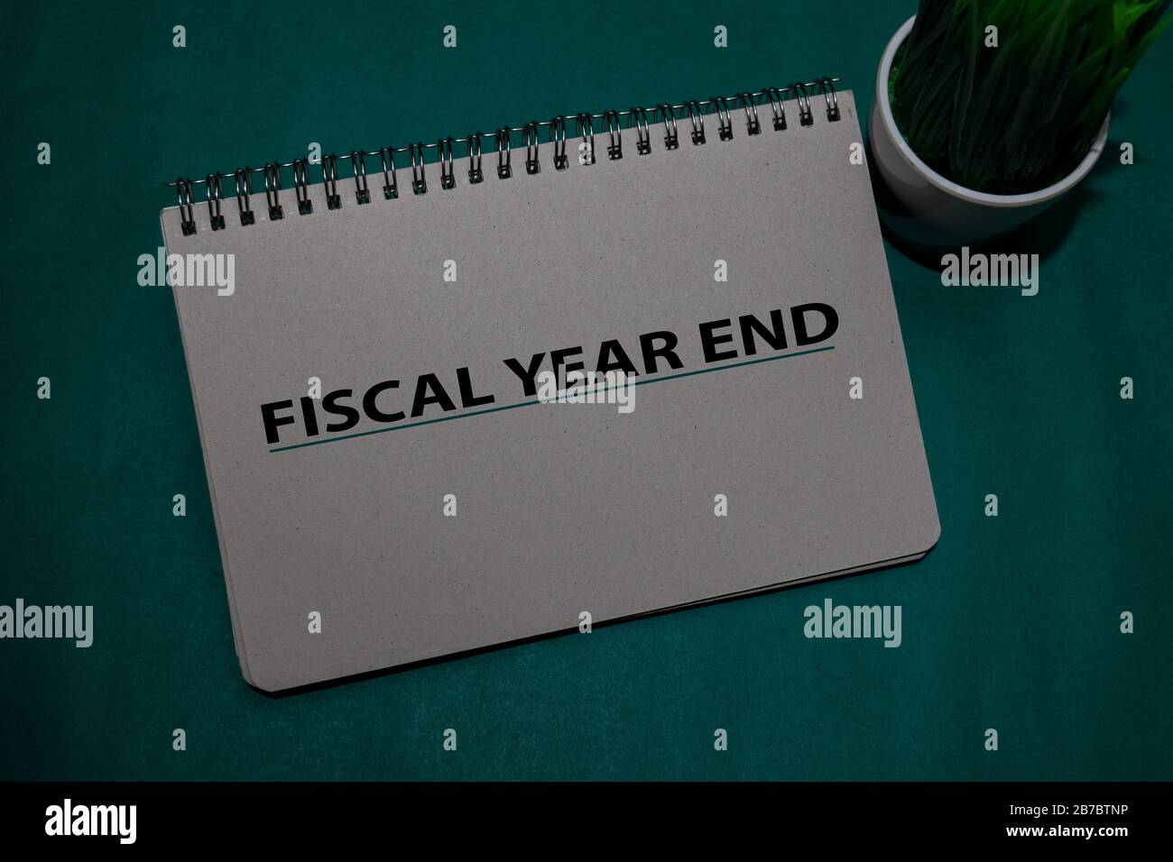 Fiscal Year End write on a book isolated on Office Desk Stock Photo - Alamy