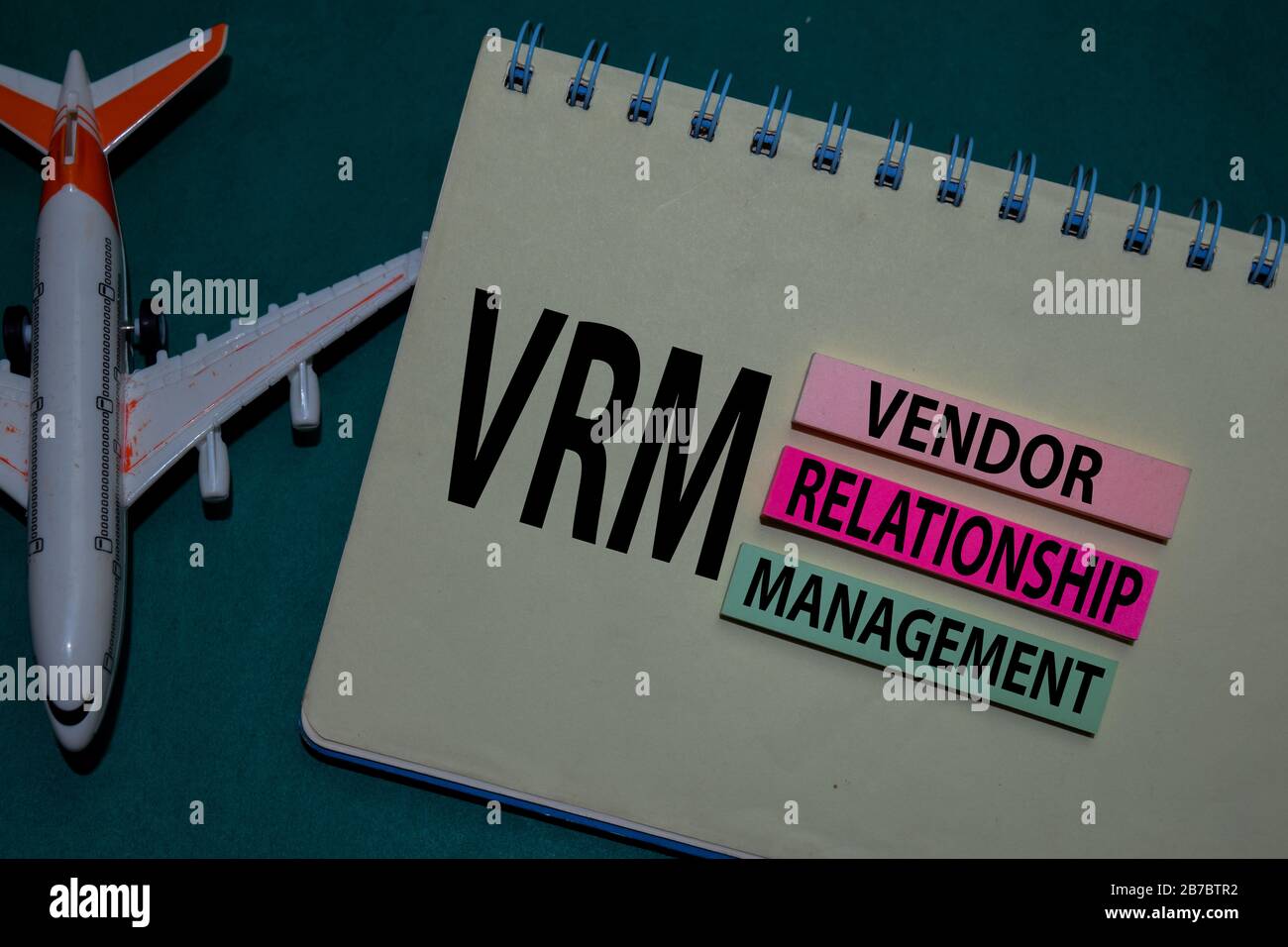 VRM - Vendor Relationship Management acronym write on a sticky note ...