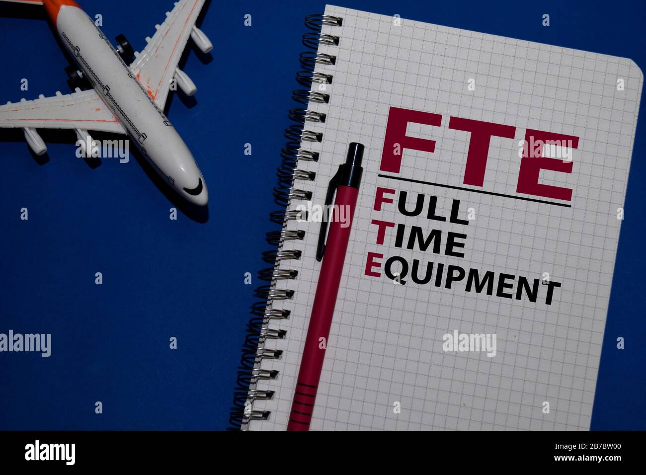 FTE - Full Time Equipment acronym write on a book isolated on Office ...