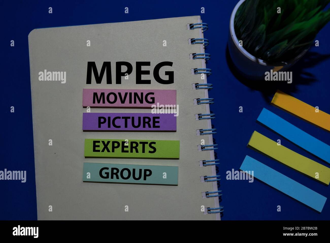 MPEG - Moving Picture Experts Group acronym write on sticky note ...