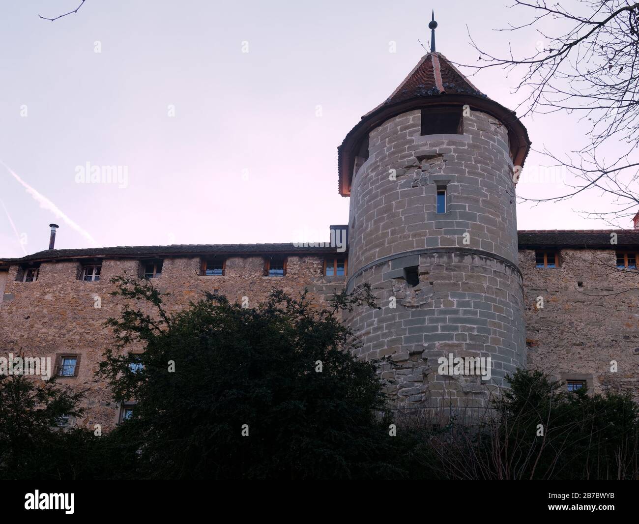 The Wall Tower and stone wall of the Bern Gate or Berntor at dusk Stock ...