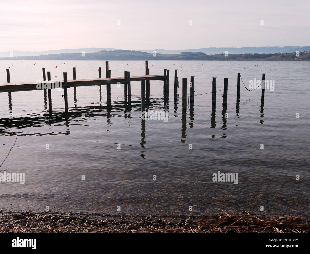 Wooden posts shore sky sunset beach hi-res stock photography and images ...