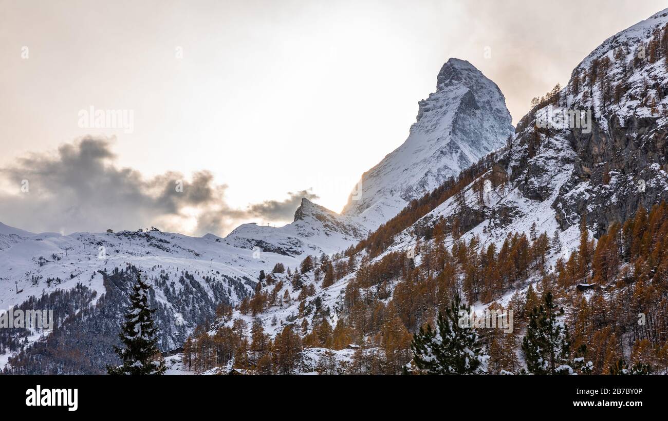 Peak of mount Matterhorn covered by snow in early winter appear from ...