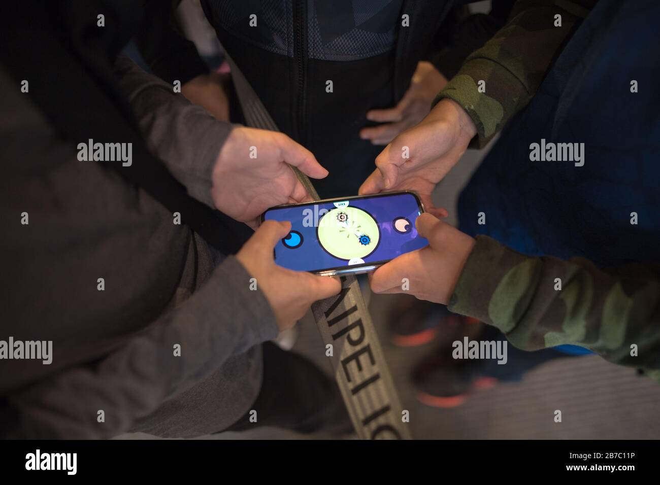 Playing app games on smartphones hi-res stock photography and images ...