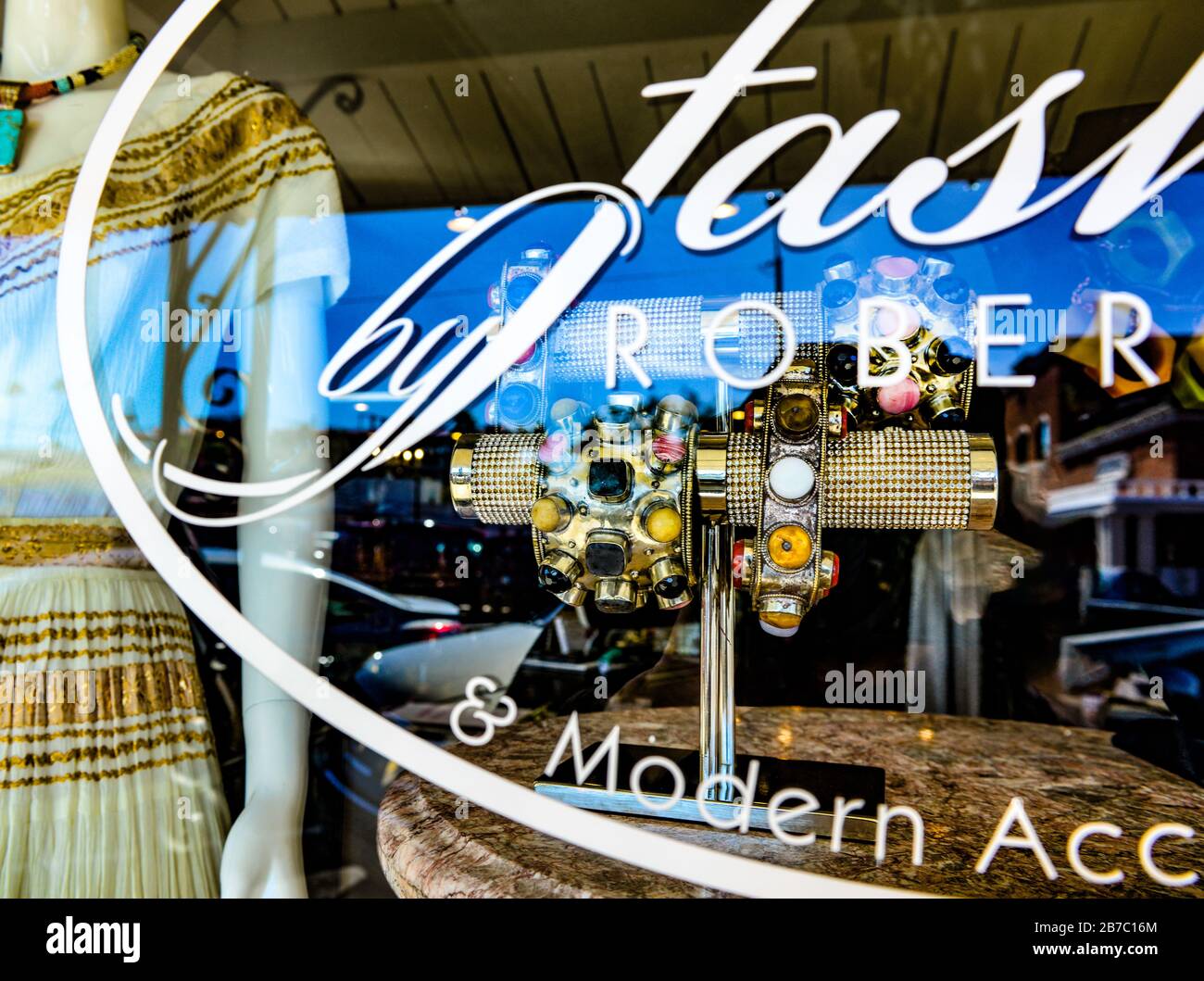 Exotic ethnic bracelets on display through the storefront widow of ...