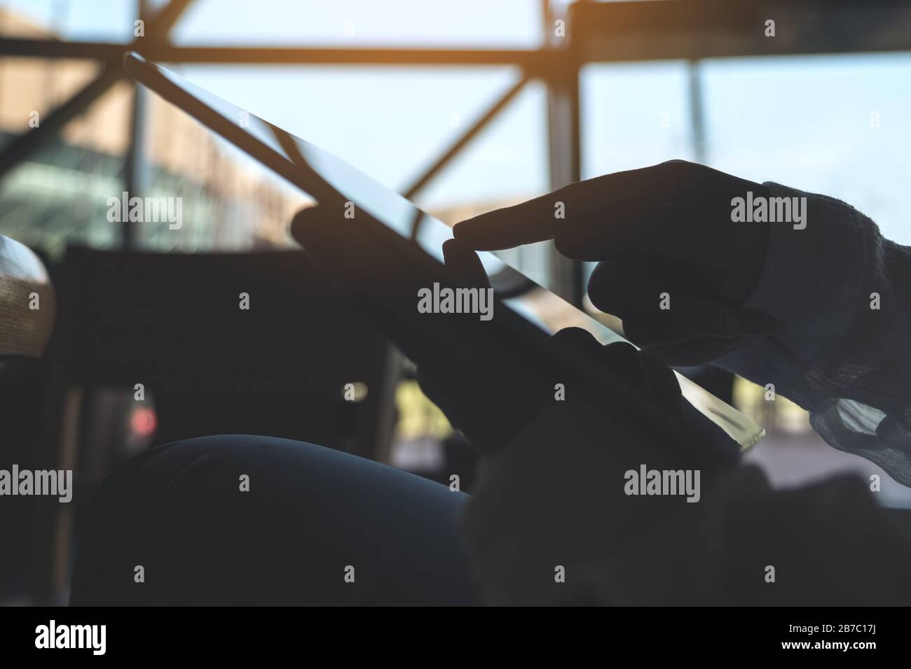 Silhouette image of a hand holding , pointing and using tablet pc Stock ...