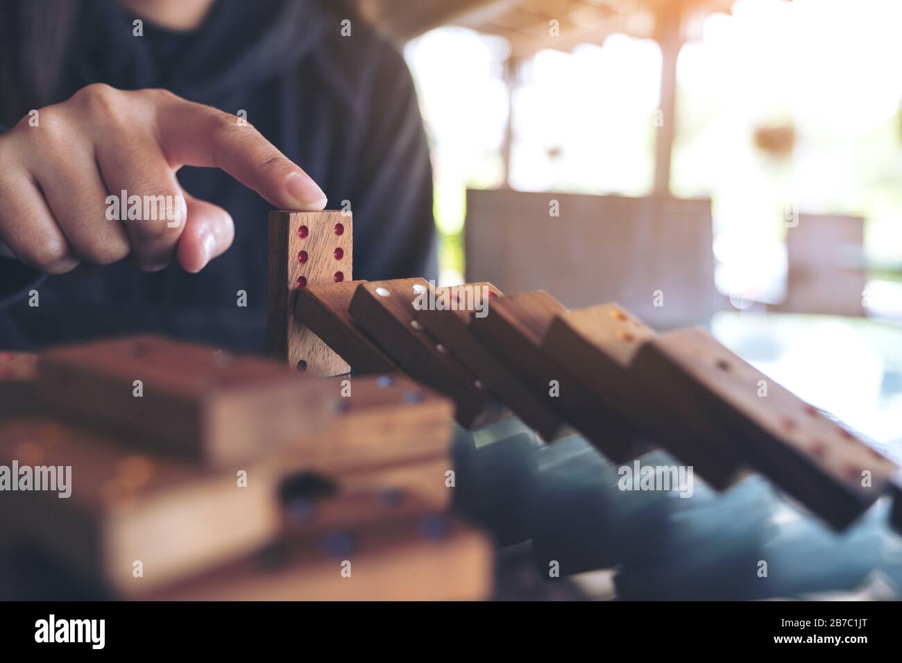 Falling row dominoes from hi-res stock photography and images - Alamy