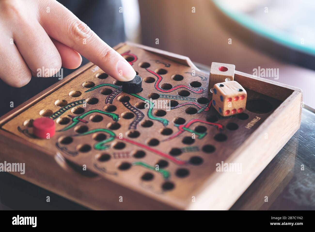 Playing snakes and ladders hi-res stock photography and images - Alamy