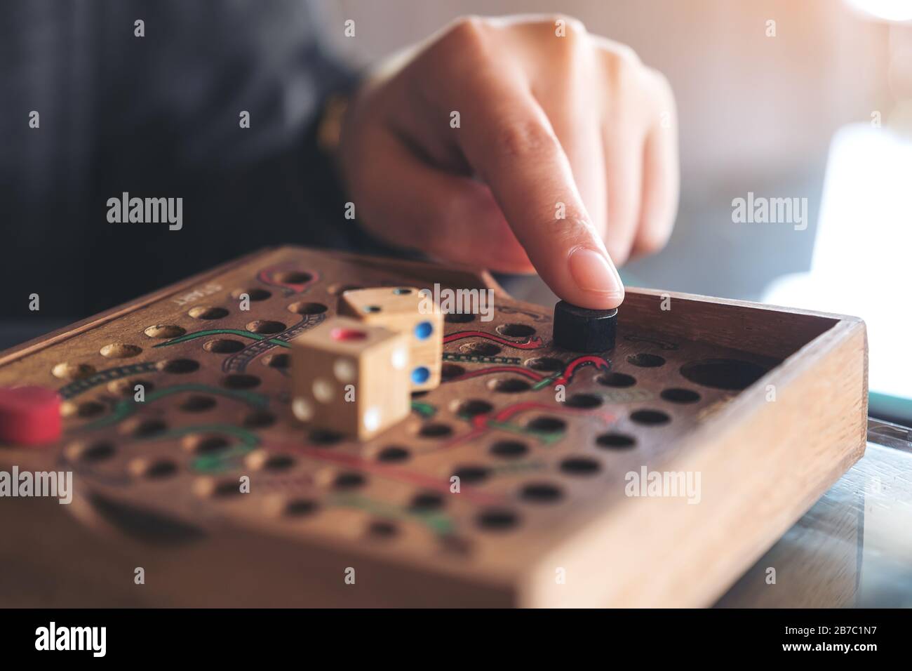 Playing snakes and ladders hi-res stock photography and images - Alamy