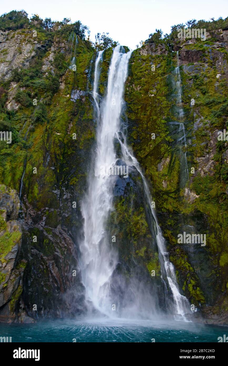 A waterfall at Milford Sound, Fiordland National Park, New Zealand ...