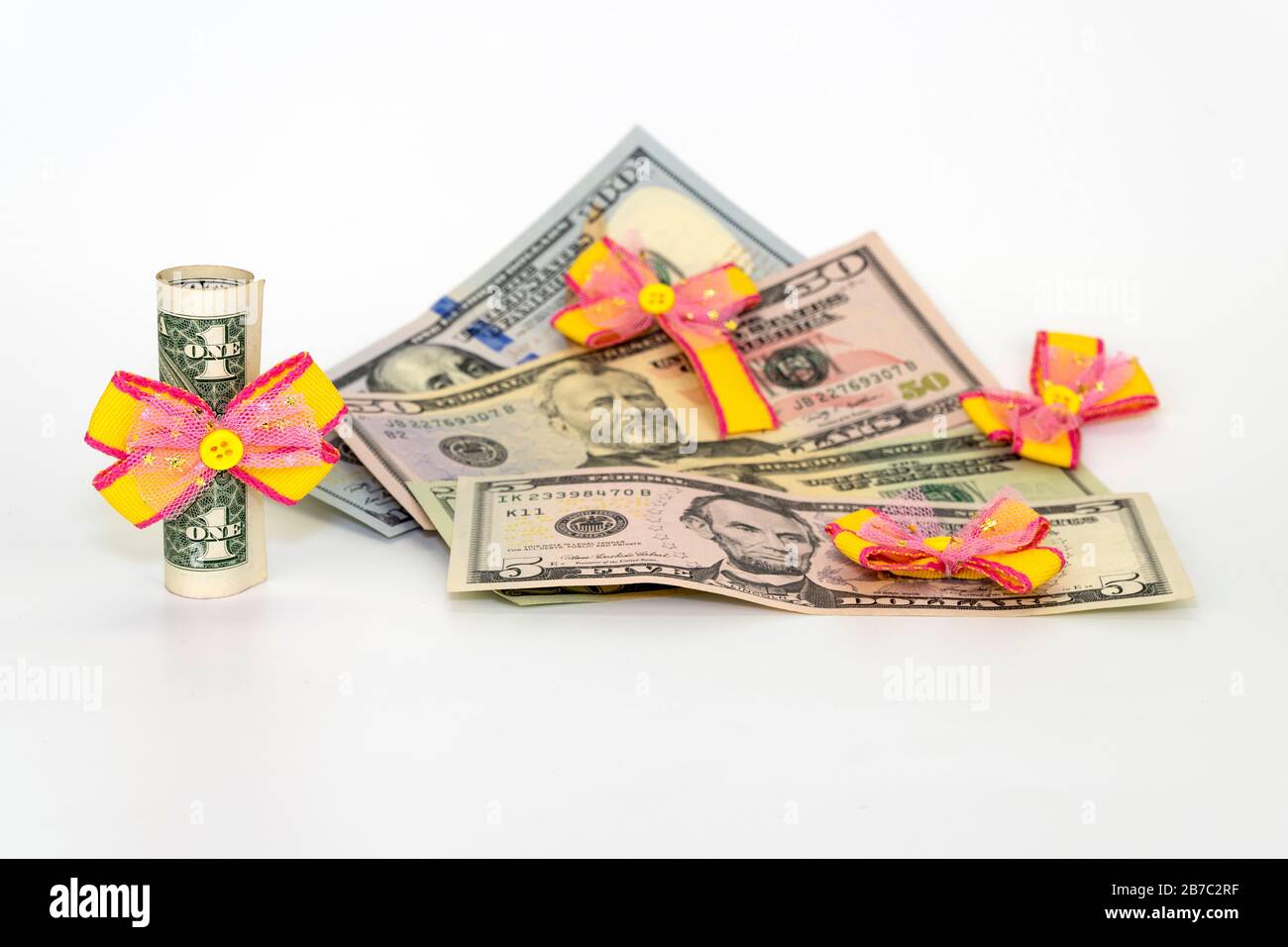 dollar tied with a festive bow. American currency, paper currency notes ...