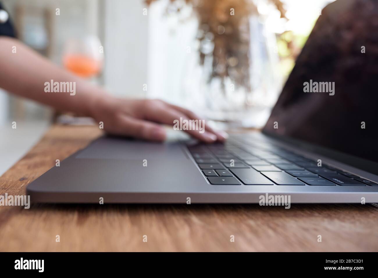 Closeup image of hands working and typing on laptop keyboard in office ...
