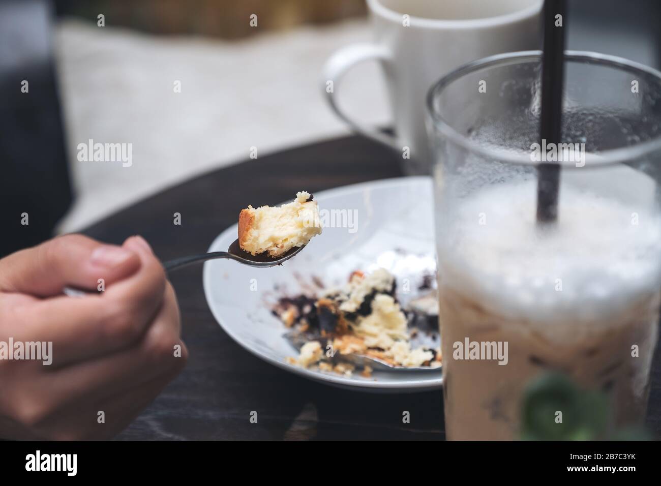 Beautiful girl eating piece cake hi-res stock photography and images ...