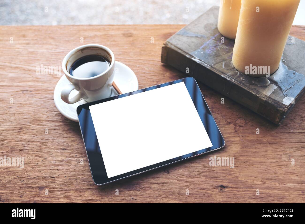 Top view mock up image of black tablet with white blank desktop screen ...