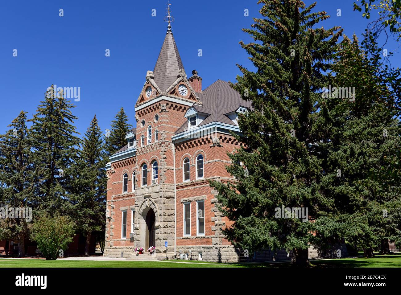 Boulder, Montana, USA - August 18, 2012: Evergreen trees surround the ...