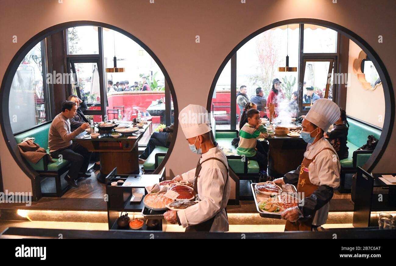 Waiters wearing masks serve hi-res stock photography and images - Alamy