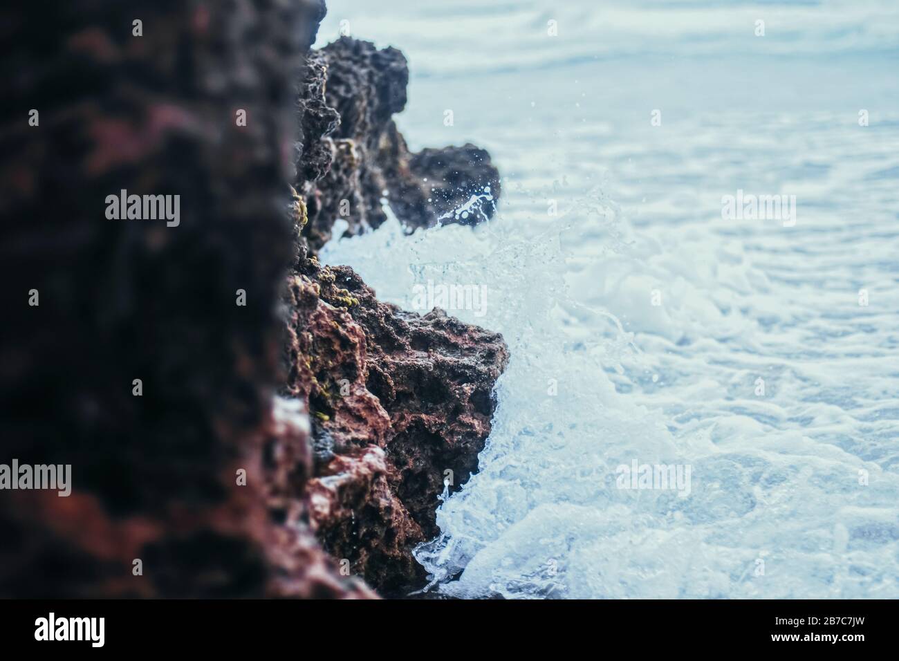Storm in the ocean, sea waves crashing on rocks on the beach coast ...