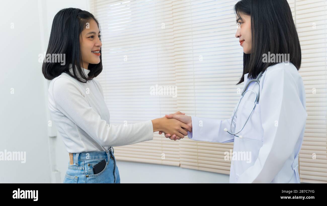 Doctor expressing his congratulations to the patient for illness ...