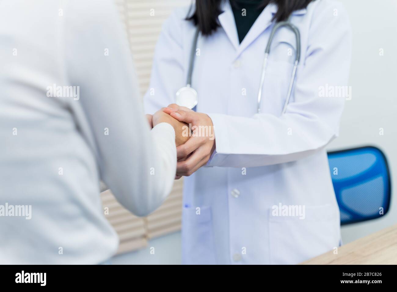 Closeup doctor patient shaking hands hi-res stock photography and ...