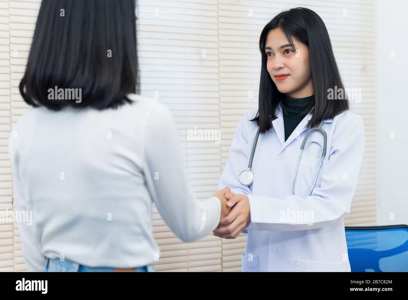 Doctor expressing his congratulations to the patient for illness ...