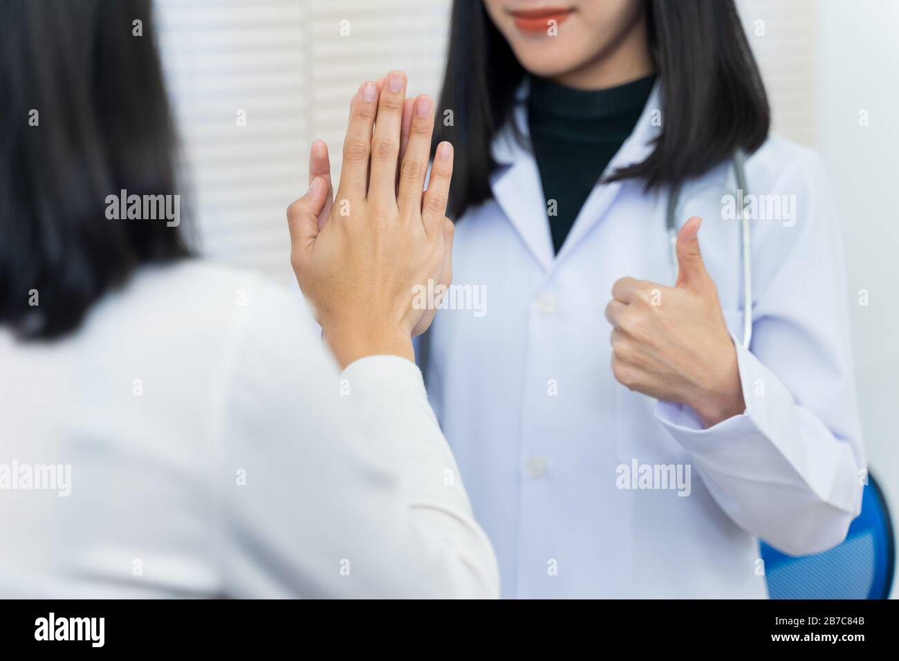Doctor expressing his congratulations to the patient for illness ...