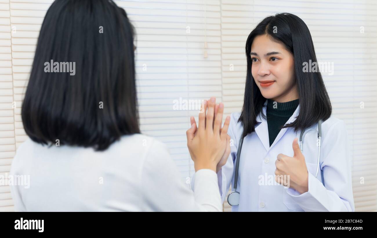 Doctor expressing his congratulations to the patient for illness ...