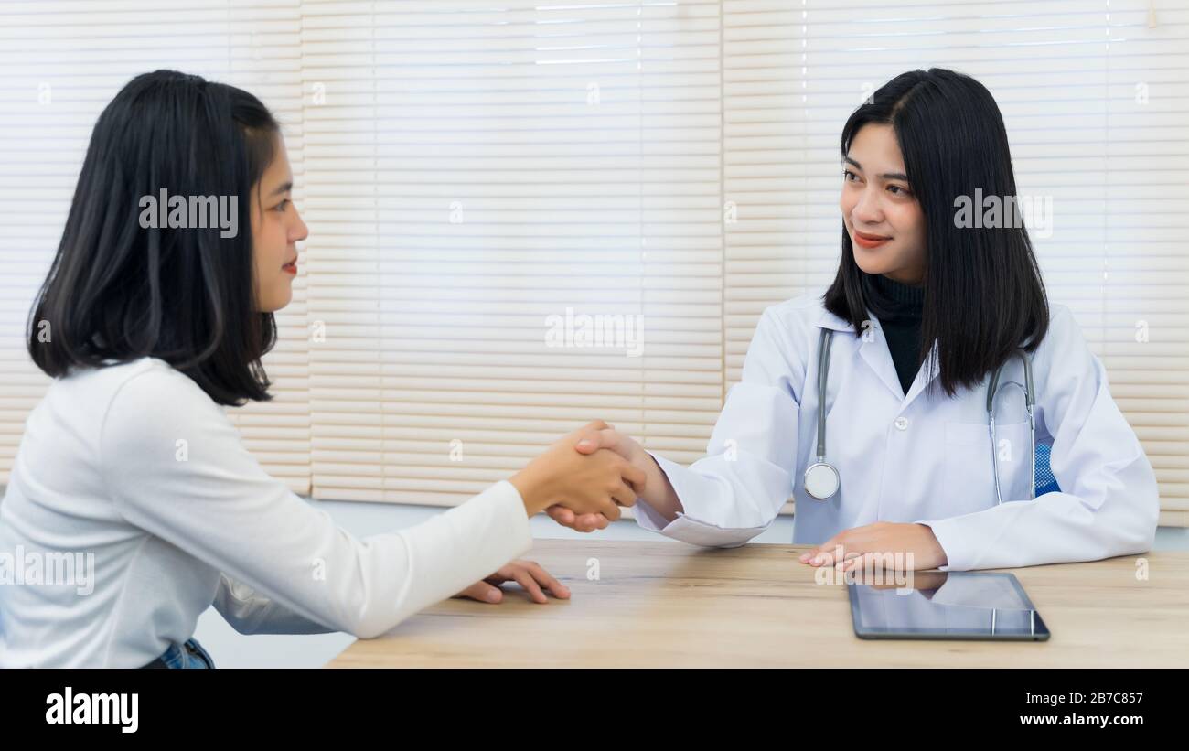 Doctor expressing his congratulations to the patient for illness ...