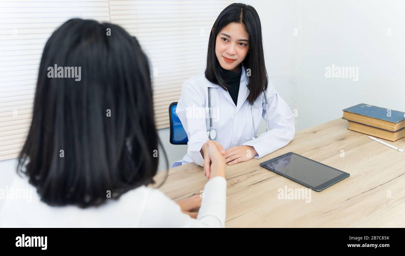 Doctor expressing his congratulations to the patient for illness ...