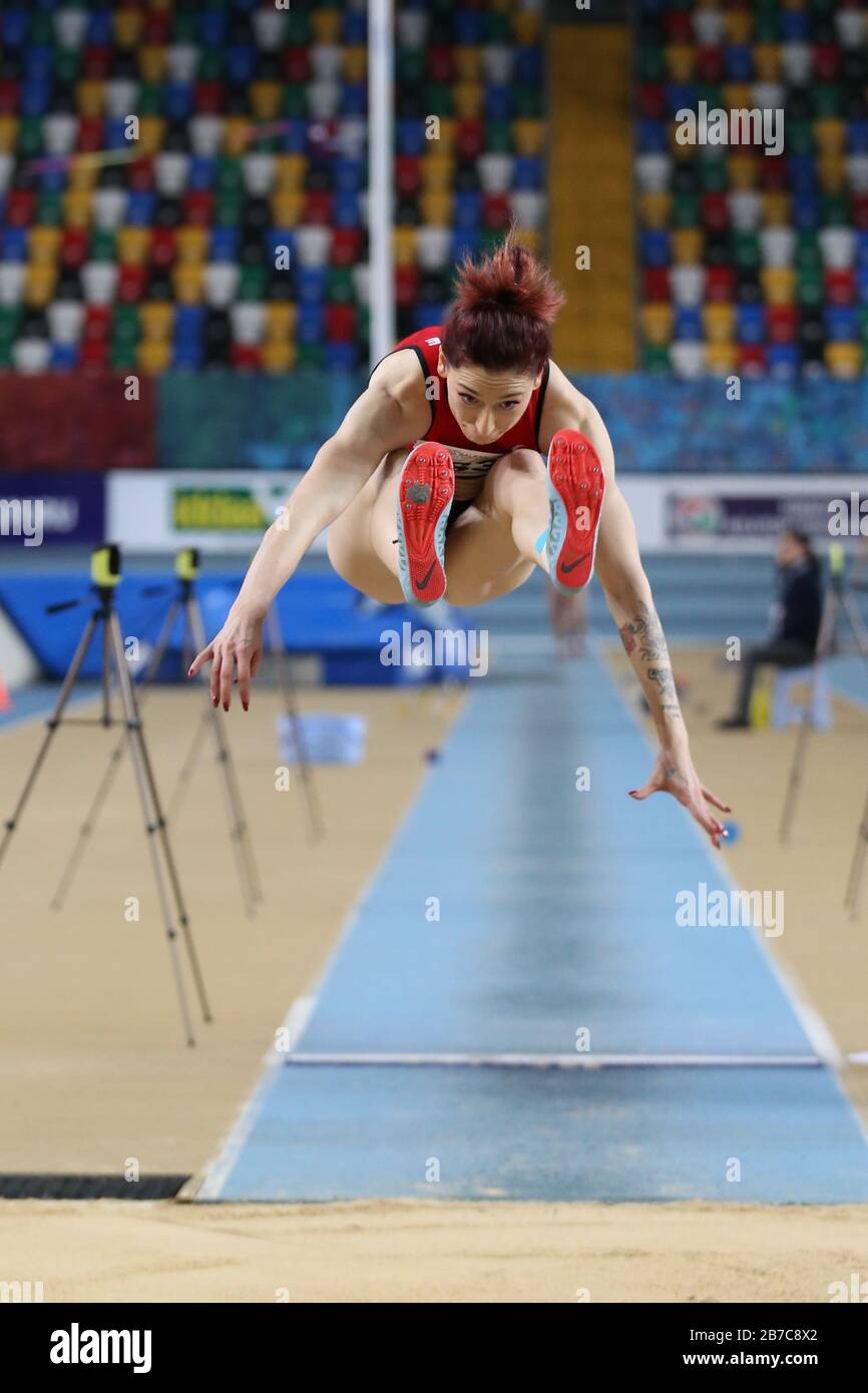 ISTANBUL, TURKEY - FEBRUARY 15, 2020: Undefined athlete long jumping ...