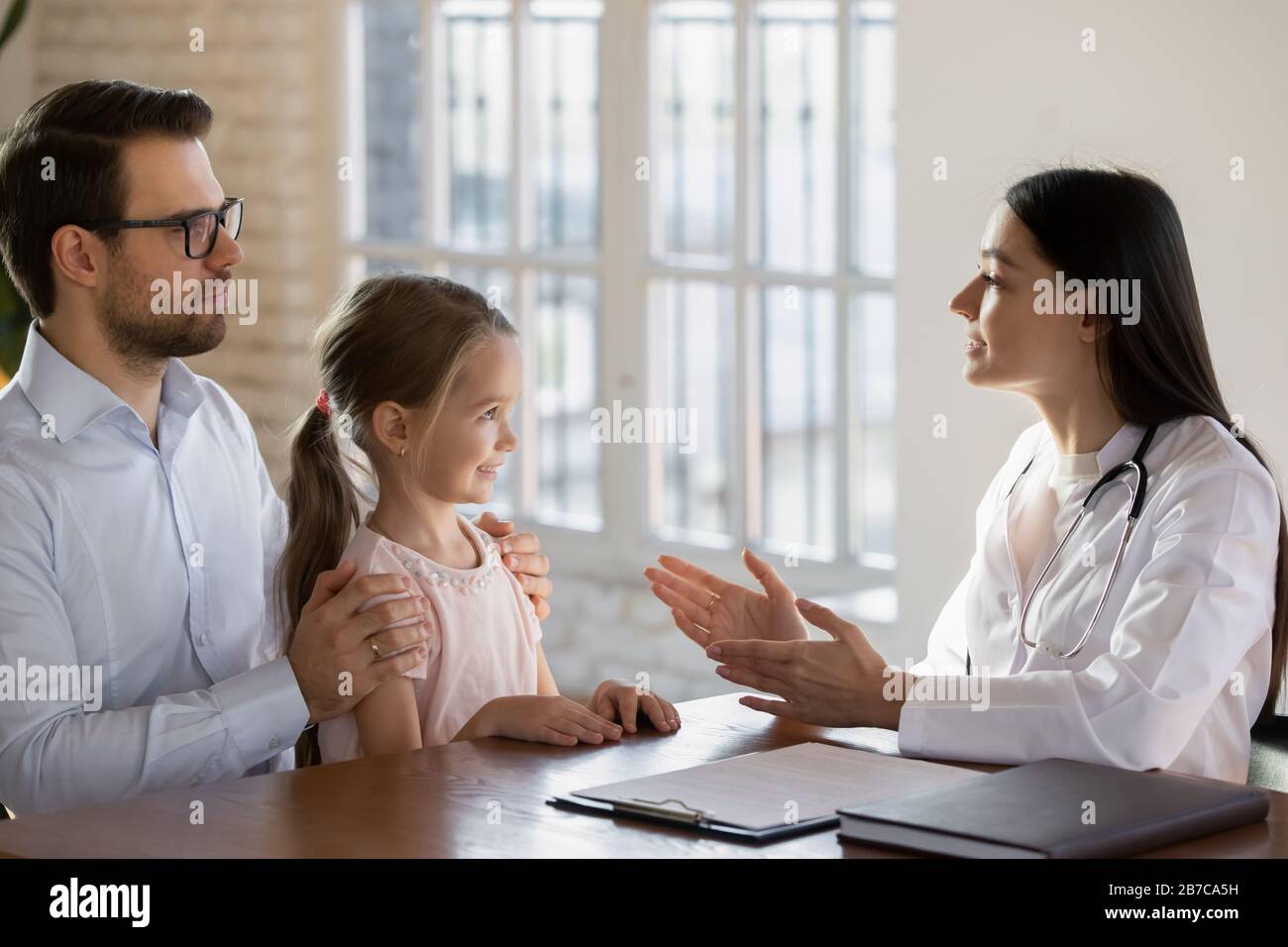 Professional medical worker explaining lab test results to patients ...