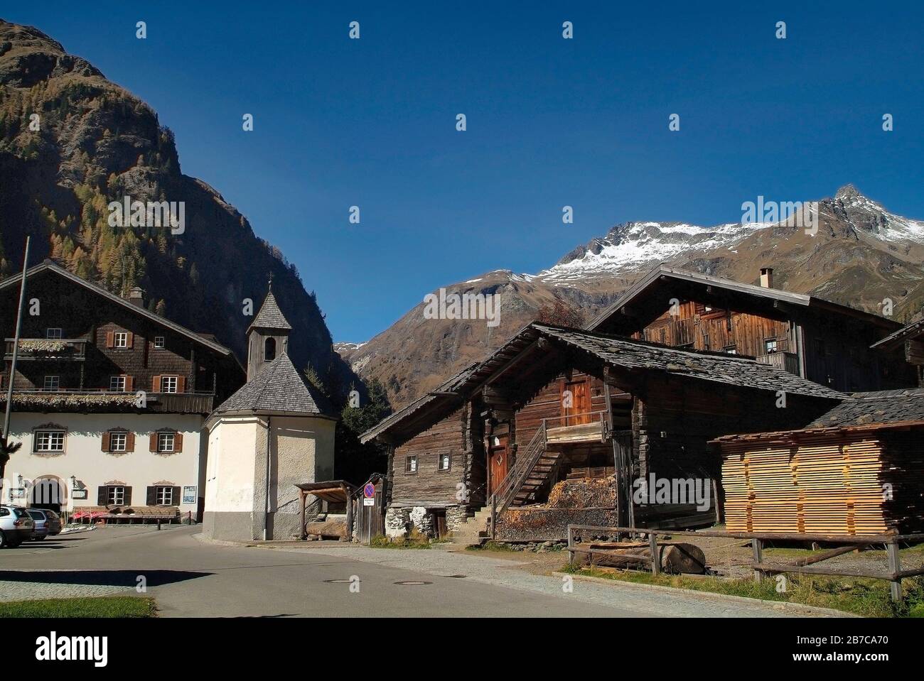 Austria, inn, chapel and wooden alpine cabins in the Austrian Alps ...