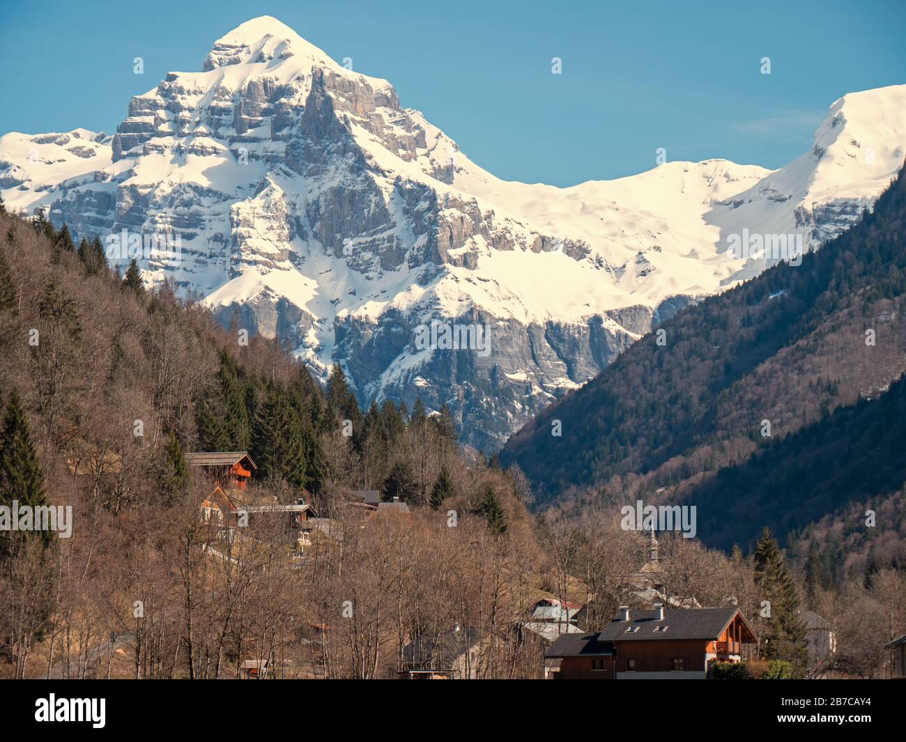 A beautiful alpine landscape in the French alps. A snow capped mountain ...