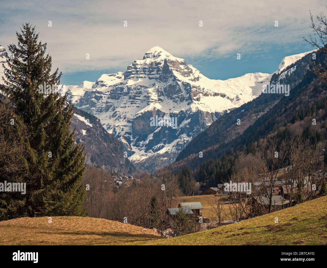 A beautiful alpine landscape in the French alps. A snow capped mountain ...