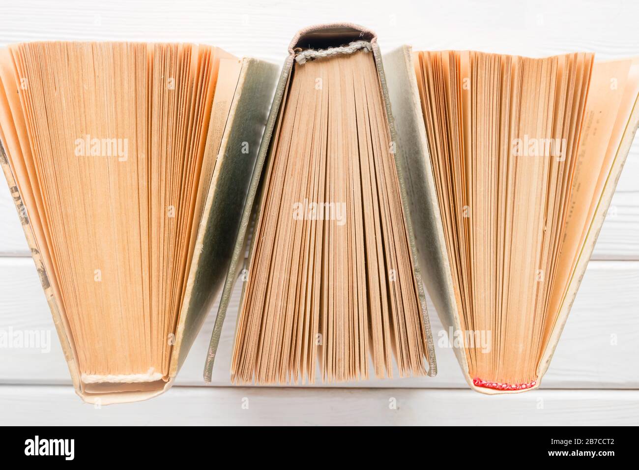 Vintage books with yellowed pages on a white background closeup Stock ...
