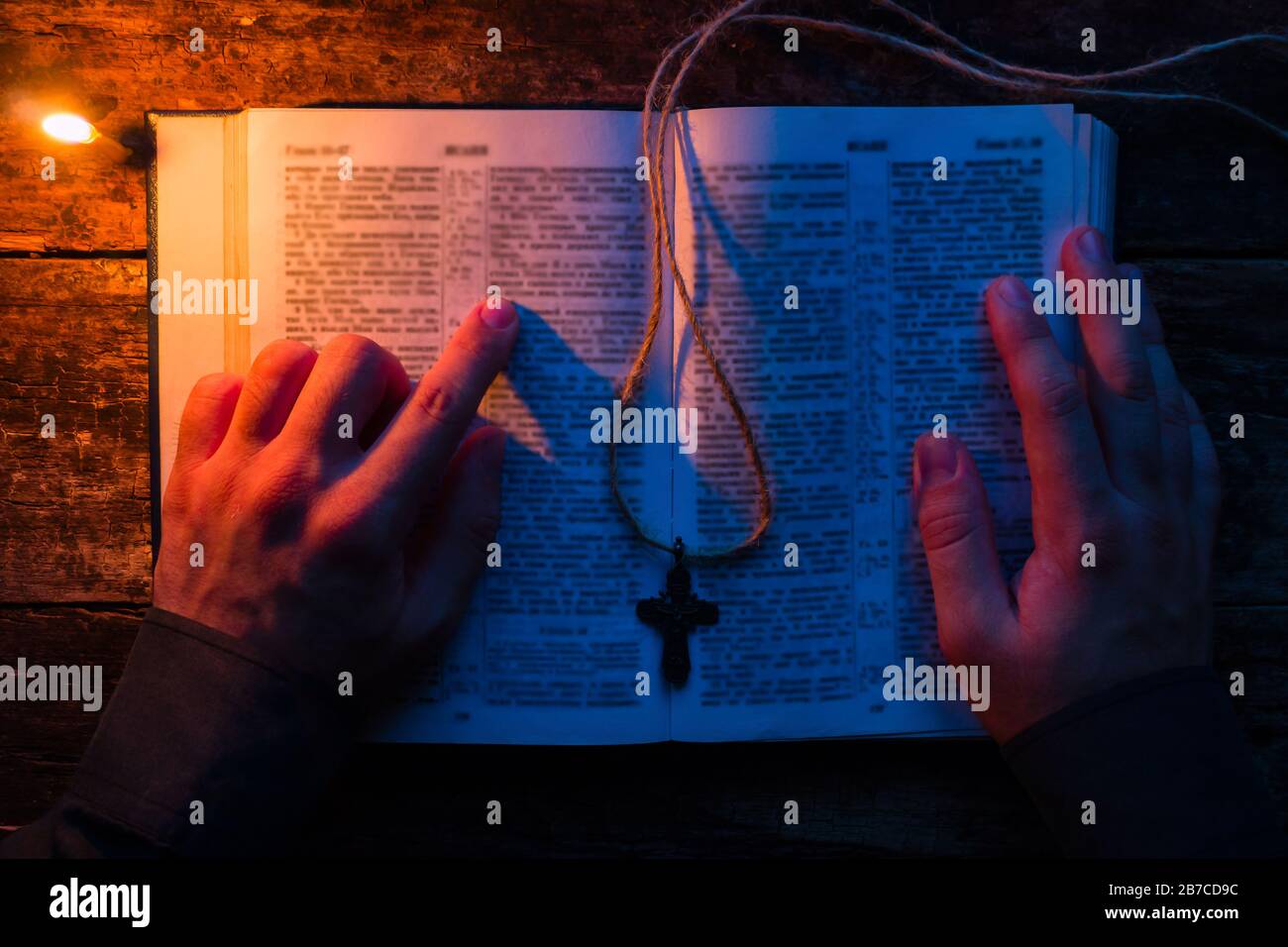 Reading candle light man hi-res stock photography and images - Alamy