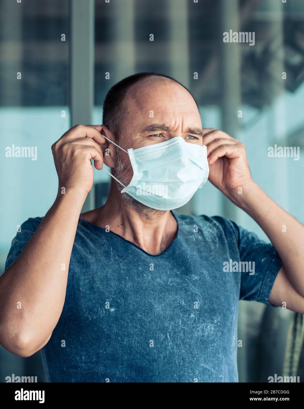 Man wearing facial disposable mask to avoid viral infection. Virus ...