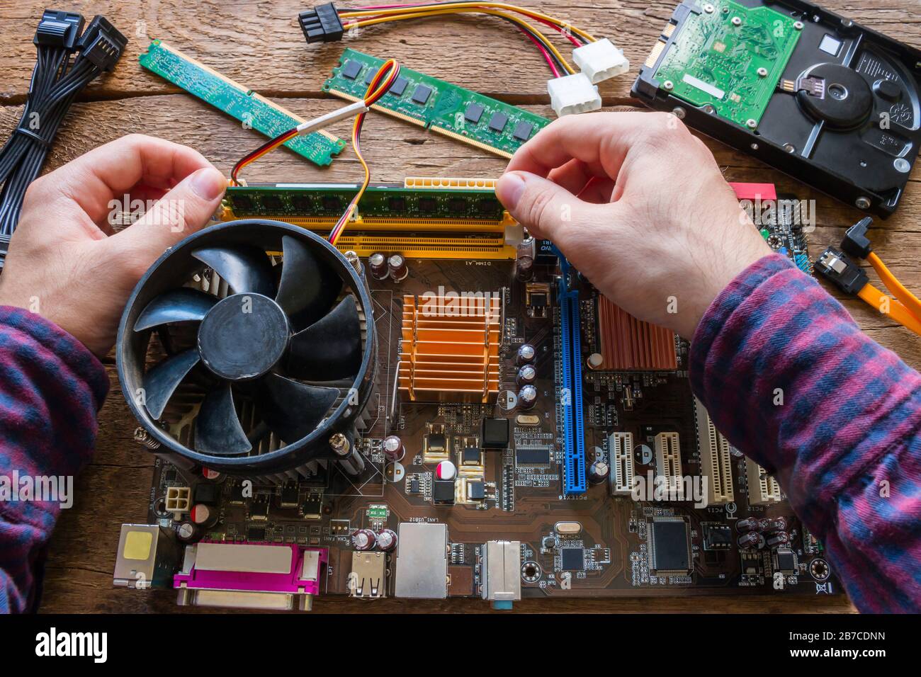 man repairing computer hardware Stock Photo - Alamy