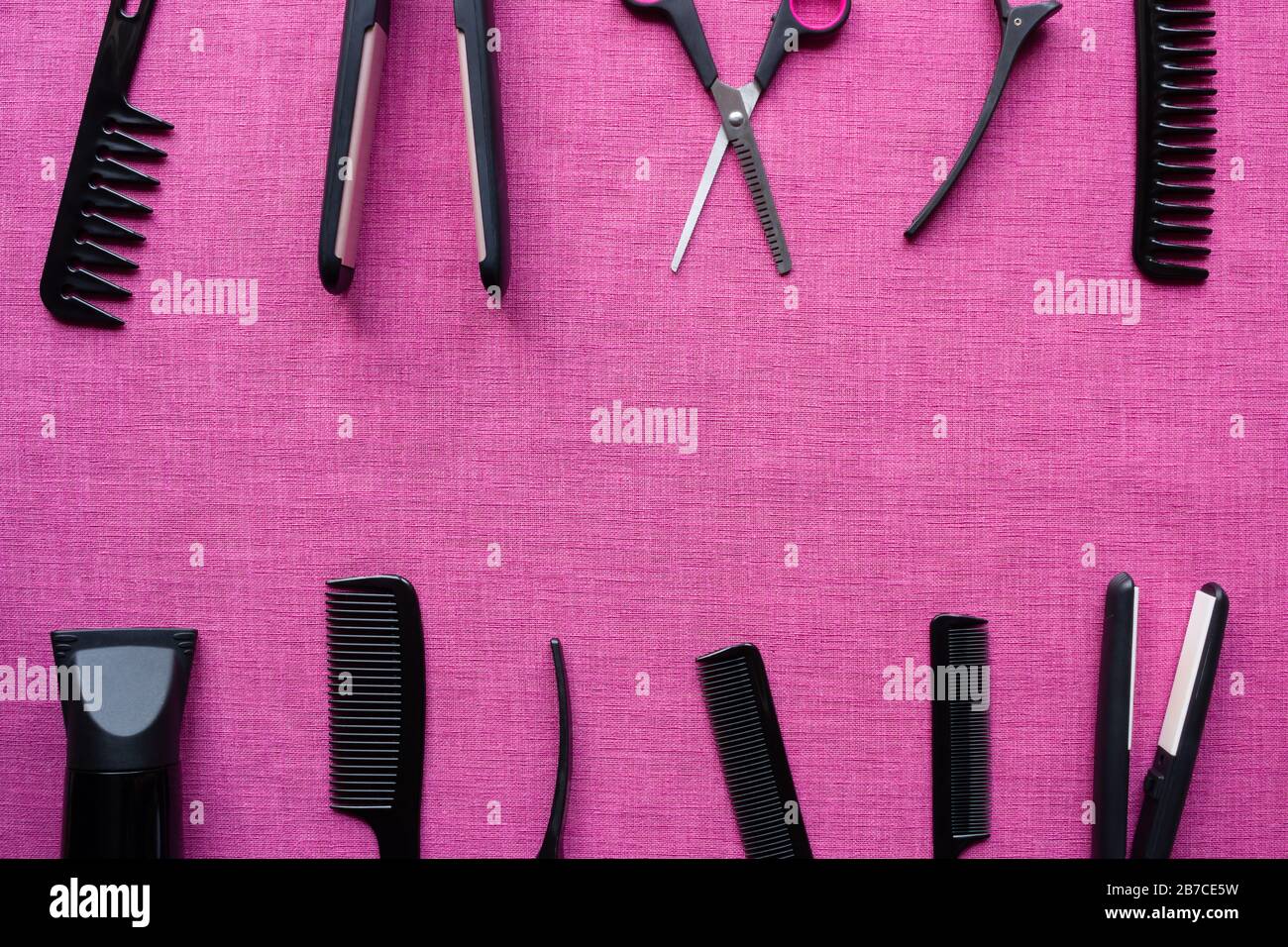 equipment for hairdresser on pink background and space for text Stock ...