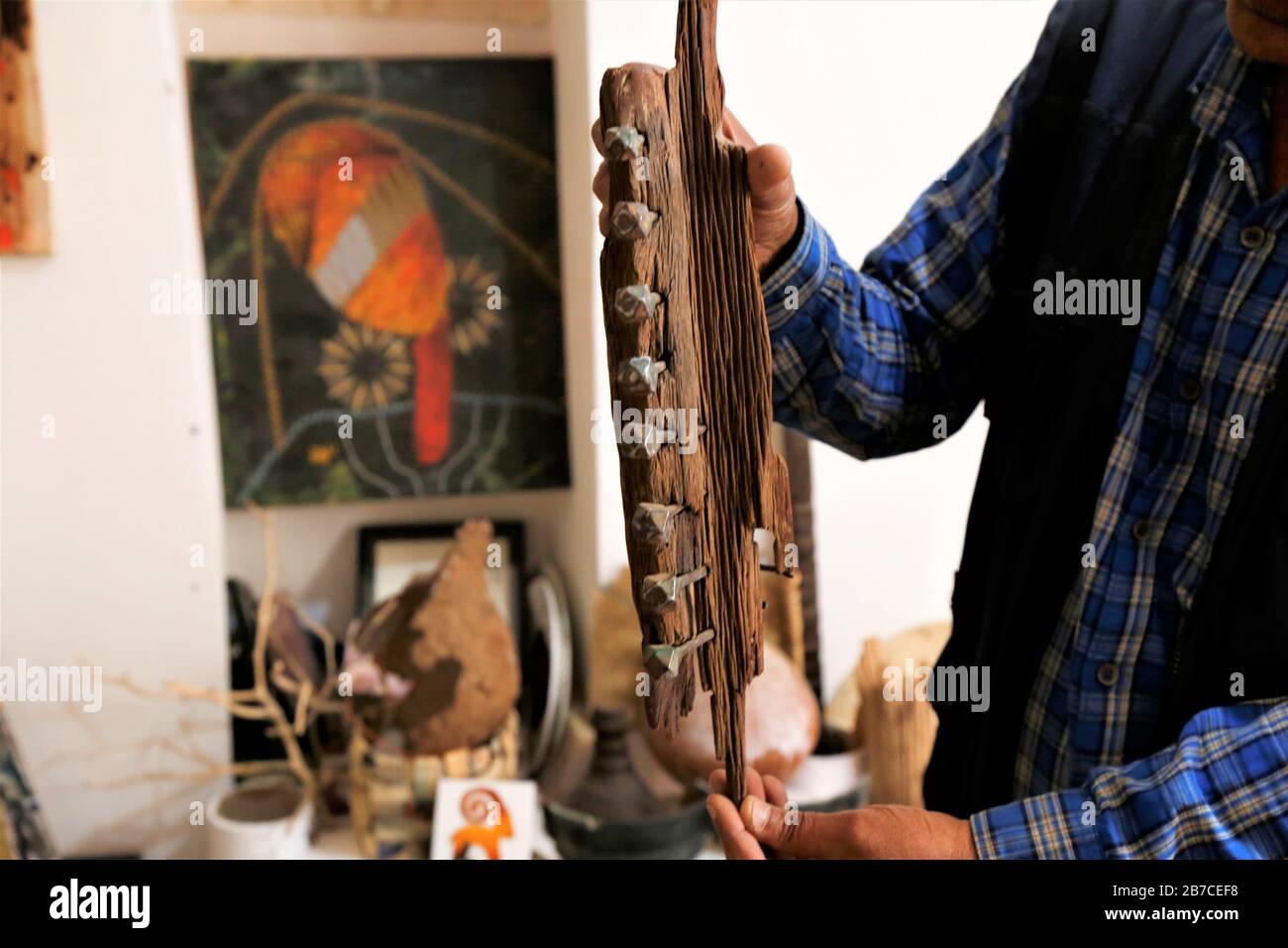 Sanaa, Yemen. 4th Mar, 2020. Yemeni artist Yassin Ghaleb shows an old ...