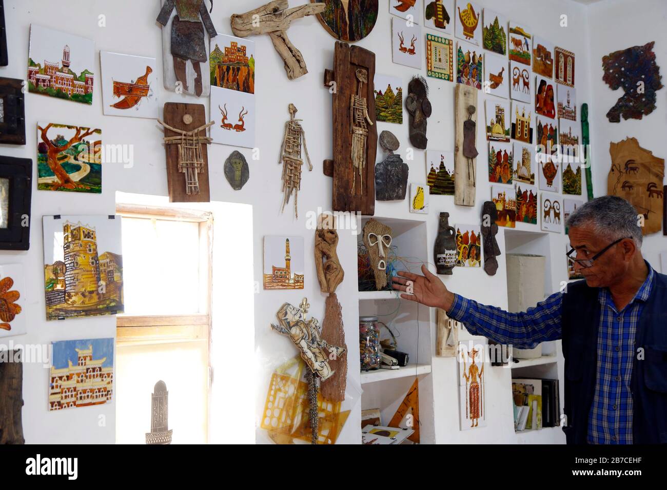 Sanaa, Yemen. 4th Mar, 2020. Yemeni artist Yassin Ghaleb introduces his ...