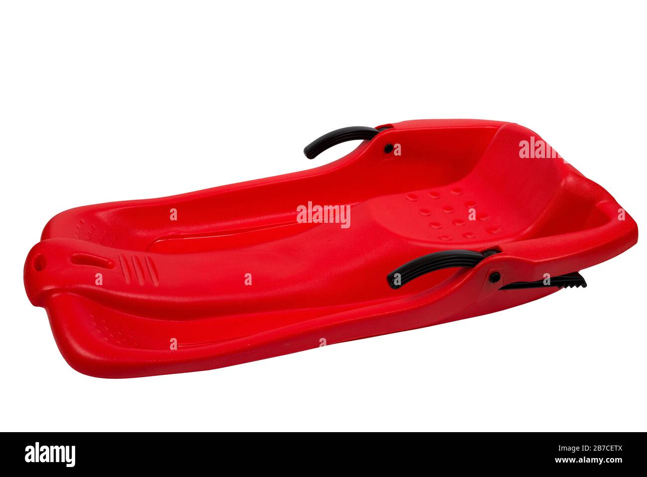 Plastic red sled for skiing on white background Stock Photo - Alamy