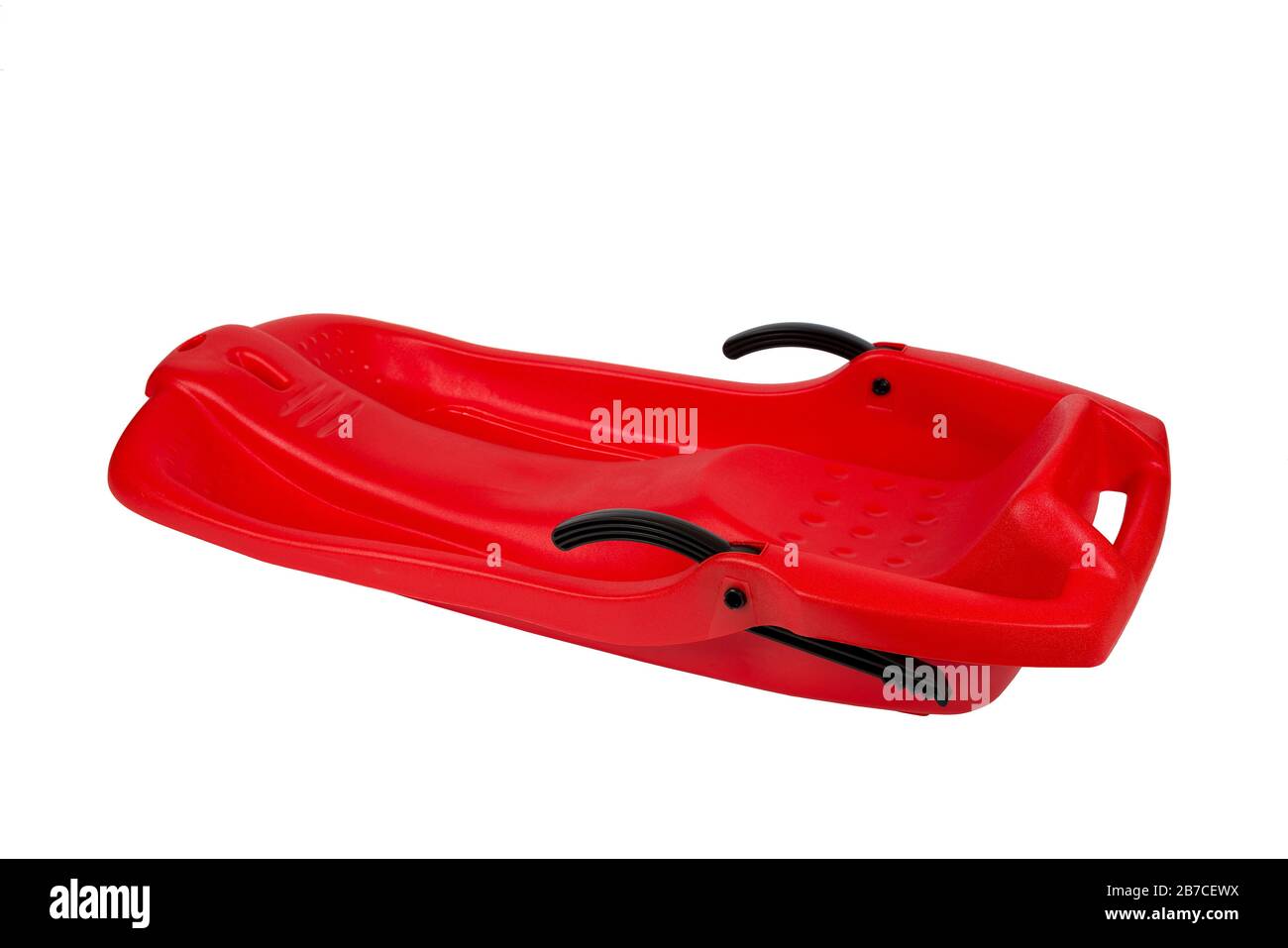 Plastic red sled for skiing on white background Stock Photo - Alamy