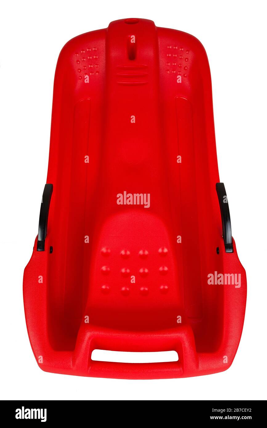 Plastic red sled for skiing on white background Stock Photo - Alamy
