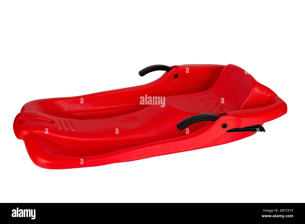 Plastic red sled for skiing on white background Stock Photo - Alamy