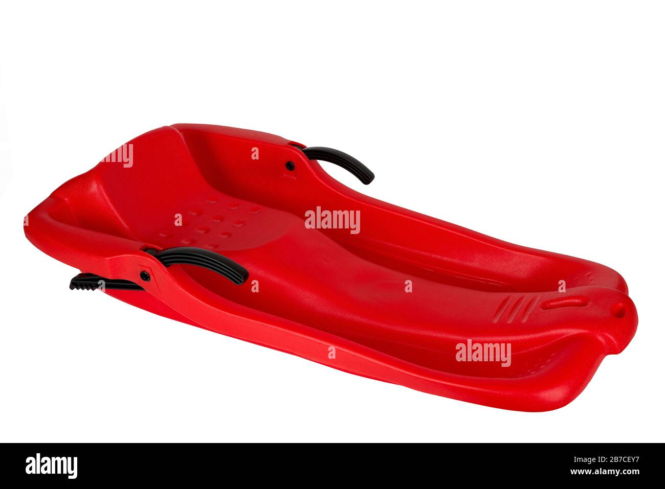 Plastic red sled for skiing on white background Stock Photo - Alamy