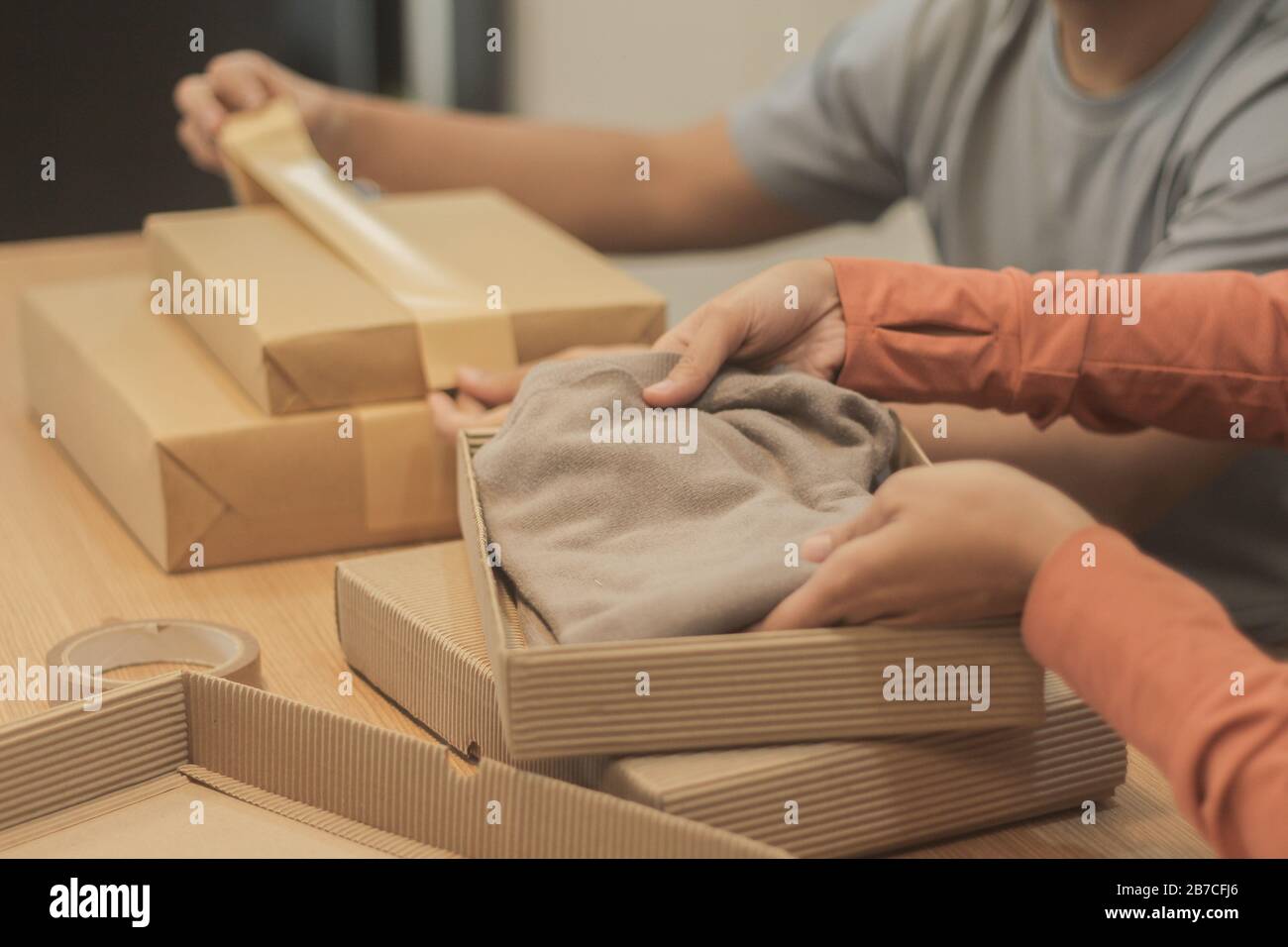 Woman putting gift boxes hi-res stock photography and images - Alamy
