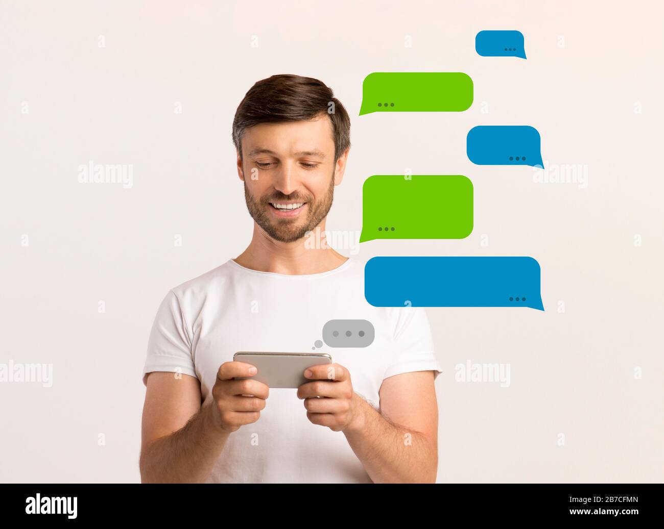 Live chat. Attractive young man communicating in social network on ...