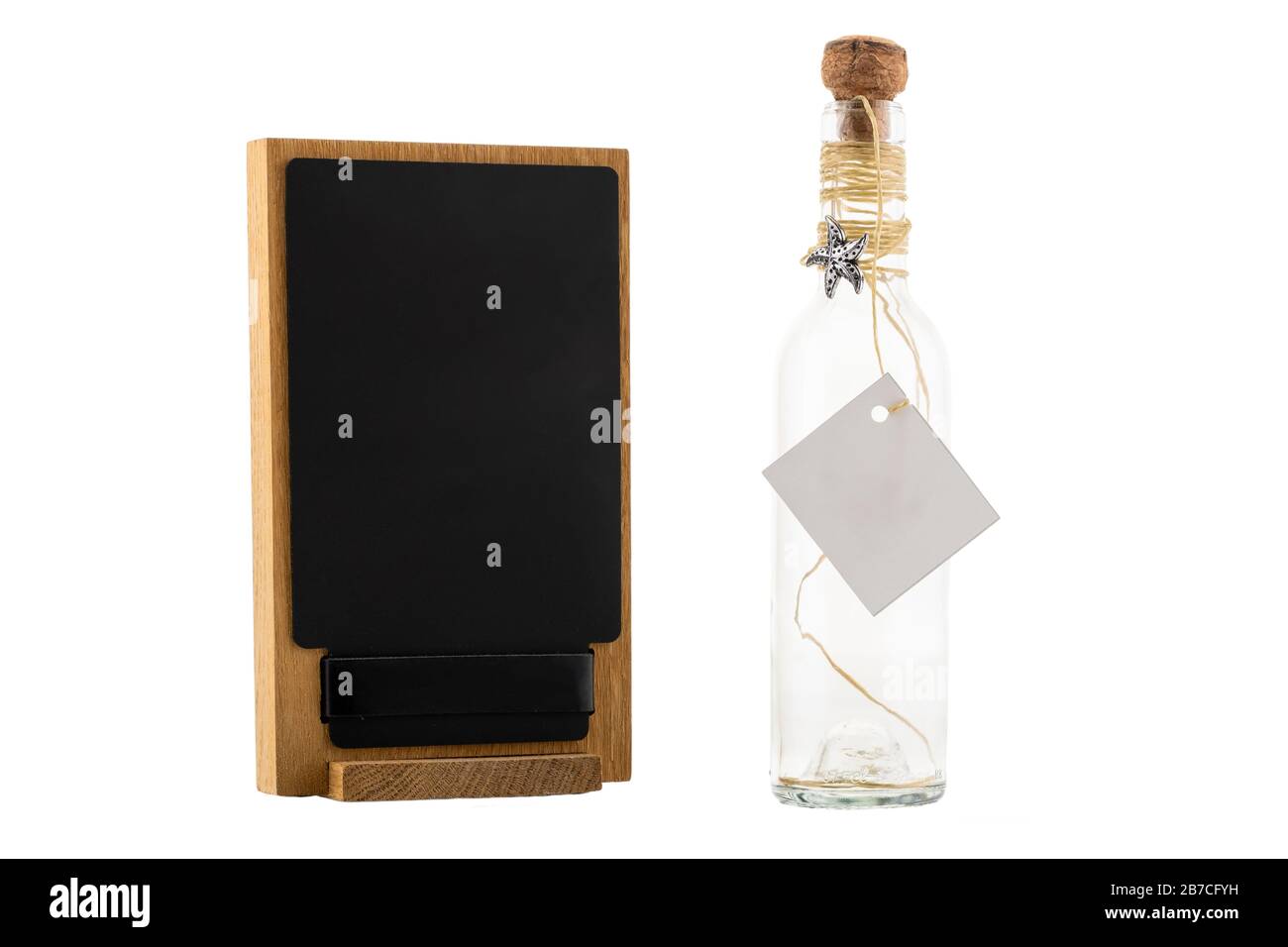 Black and wooden mock-up menu frame with a glass bottle on the side on ...